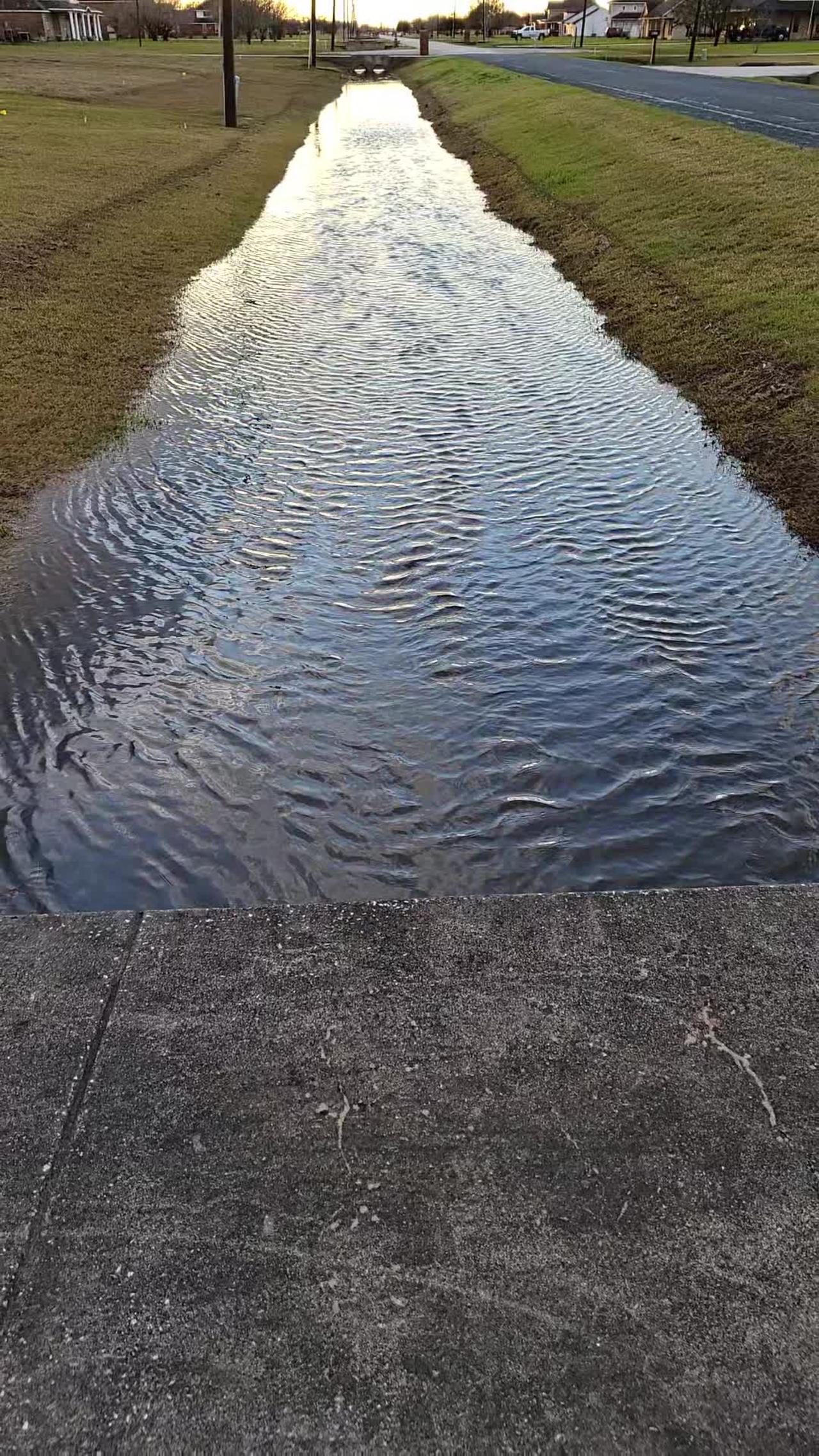 water in drainage ditch receding after stormy - One News Page VIDEO