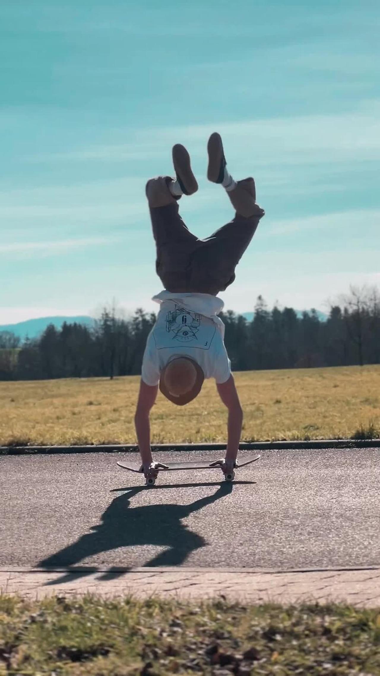 Guy does a handstand finger flip on a rolling - One News Page VIDEO