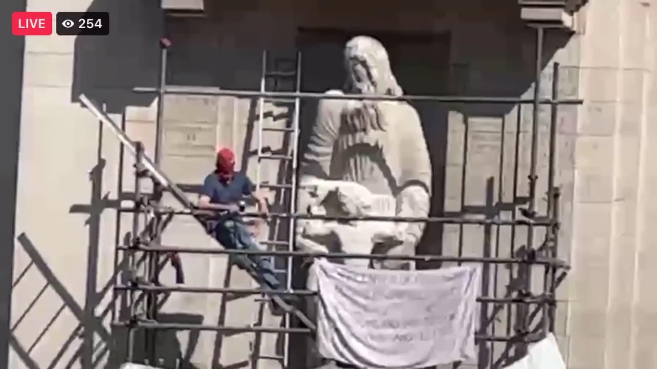 Spiderman on building of BBC breaking the statue - One News Page VIDEO