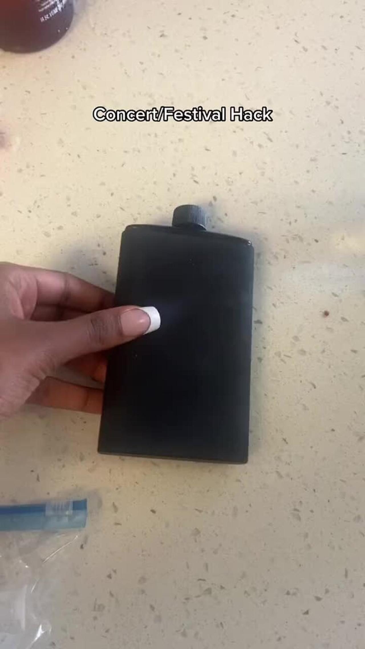 Person is showing off a secret flask, hidden by - One News Page VIDEO
