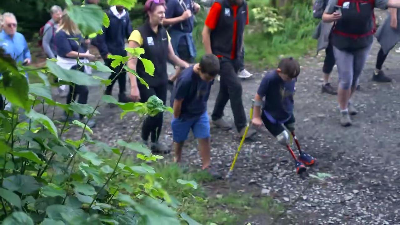 Eight-year-old double-amputee scales Lake - One News Page VIDEO